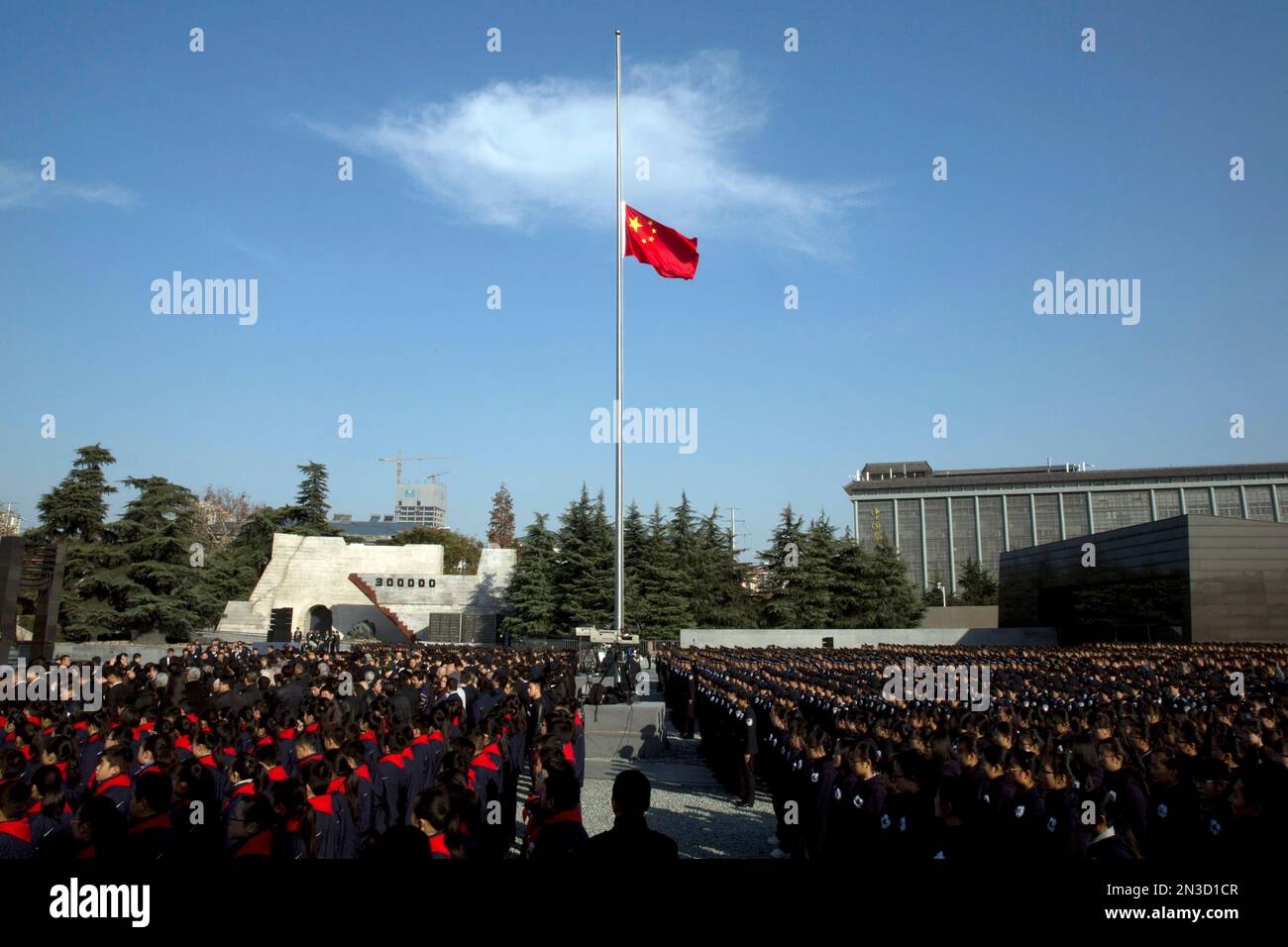 Soldiers, students, and survivors of the Nanking massacre attend a ...