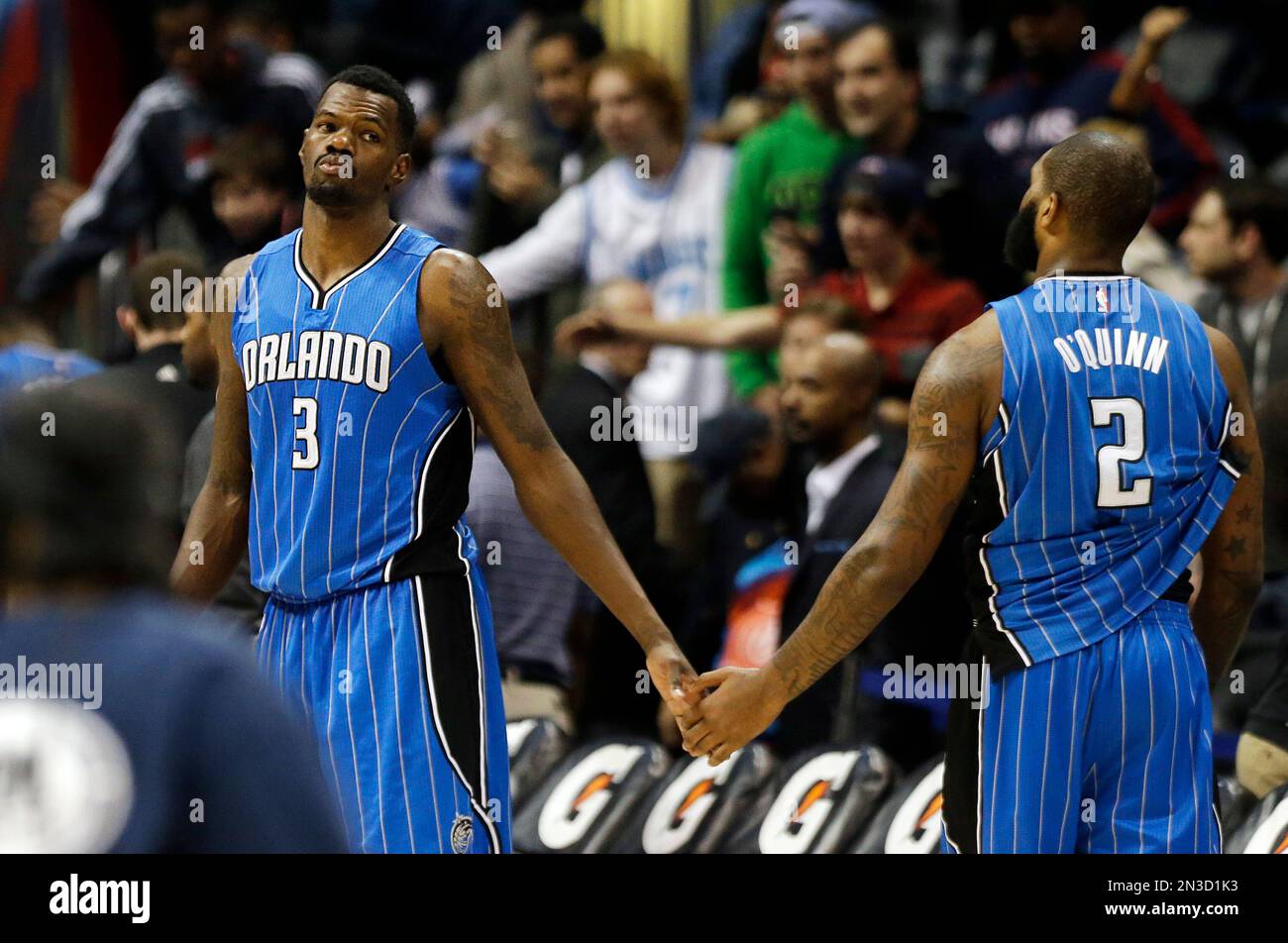 Orlando Magic's Dewayne Dedmon, left, high-fives teammate Kyle O'Quinn ...
