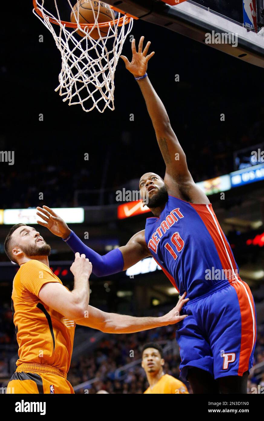 Detroit Pistons' Greg Monroe (10) goes up for a shot as Phoenix Suns ...