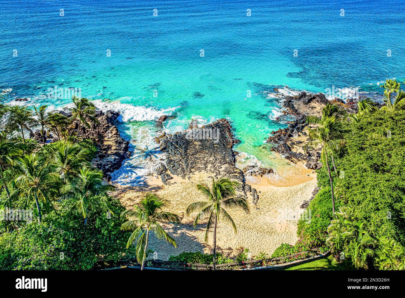 Aerial view of the coastline and turquoise water at the Secret Cove ...