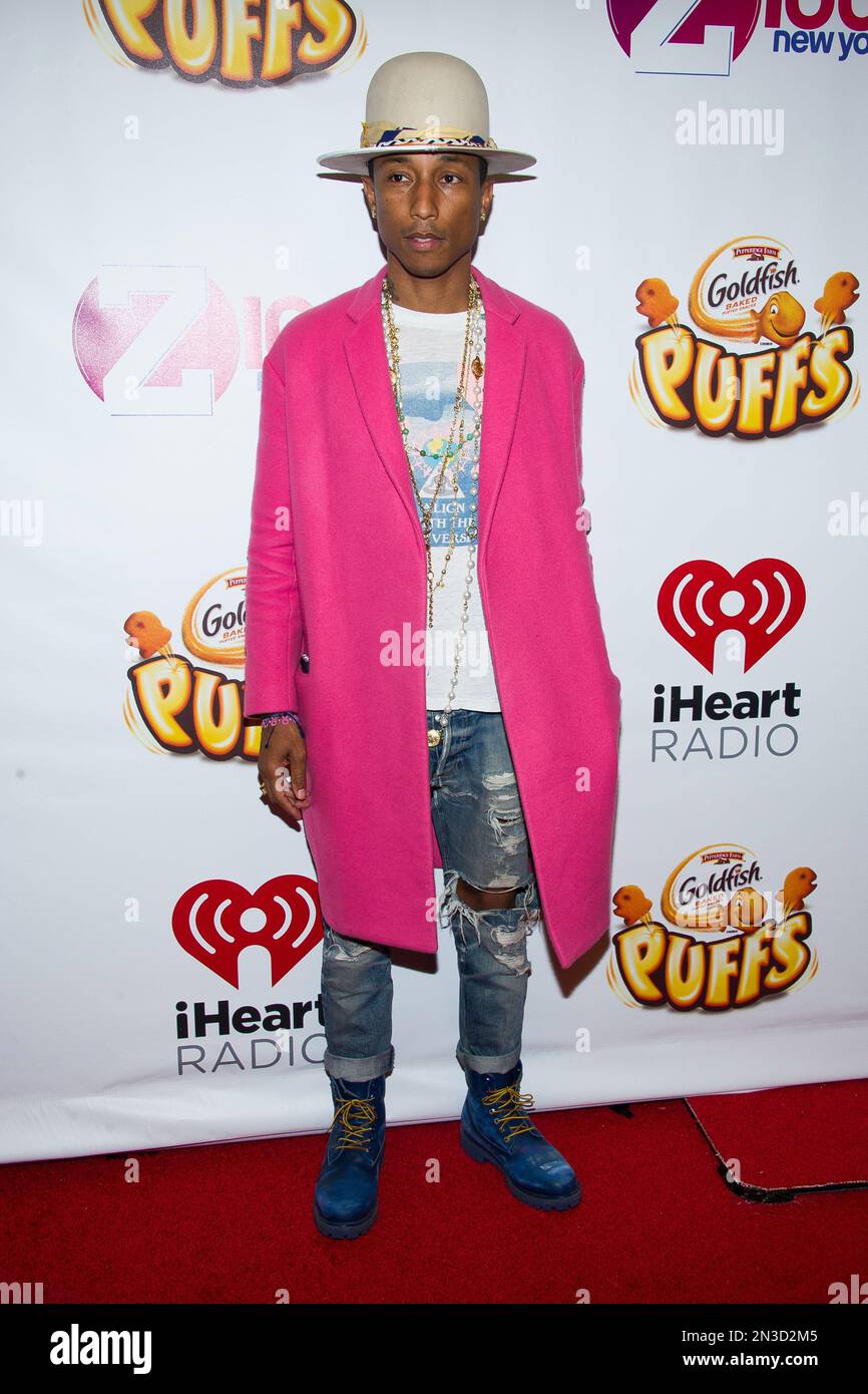 Pharrell Williams poses in the Z100 Jingle Ball press room at Madison ...