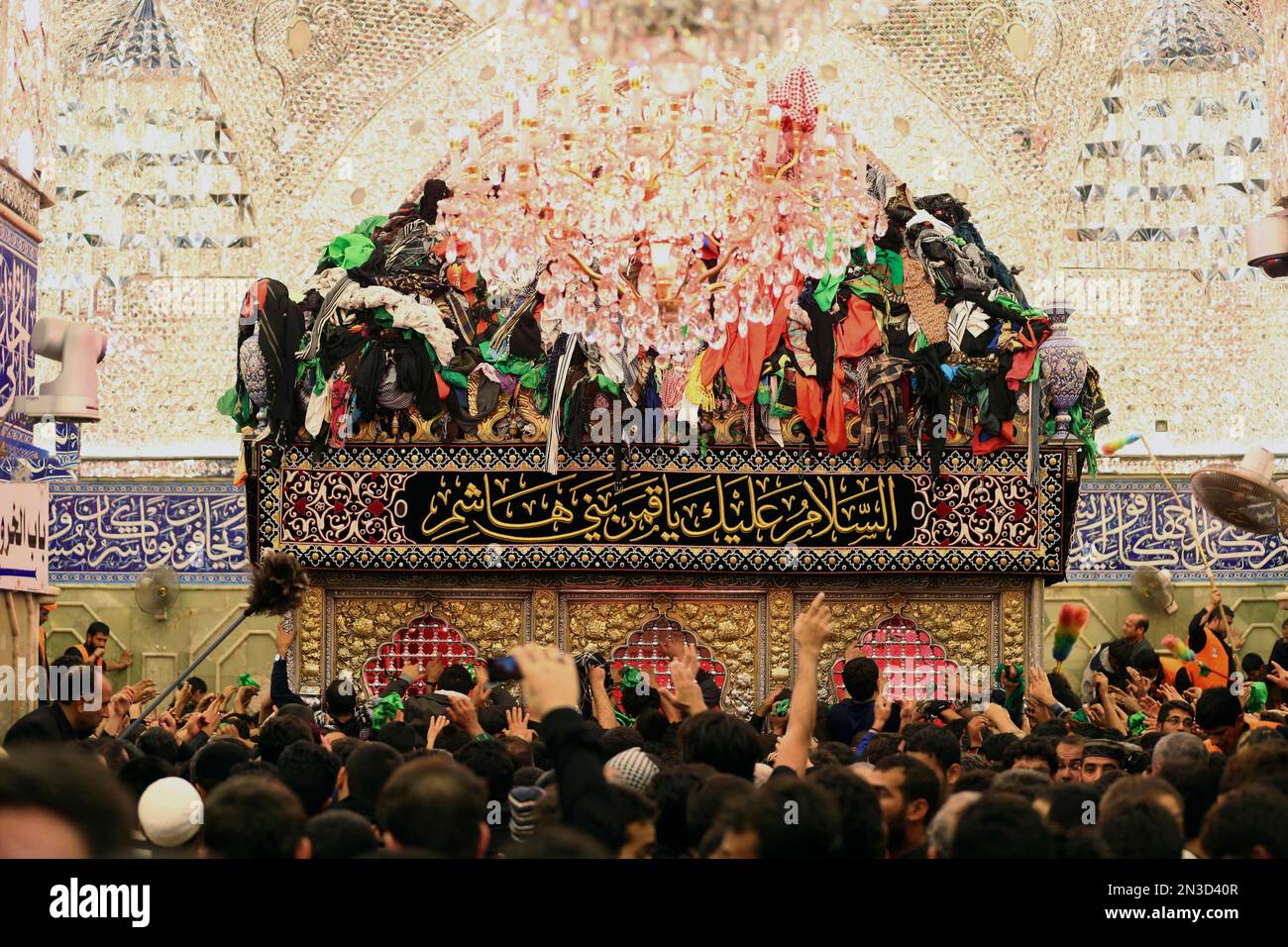 Shiite faithful pilgrims pray at the holy shrine of Imam Abbas during ...