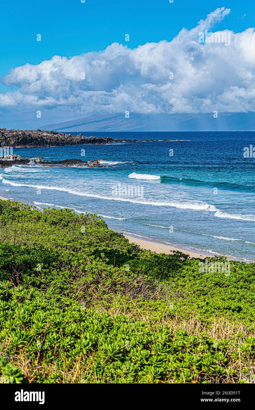 Blue sky and cumulus clouds hover over the Hawaiian Islands with the ...