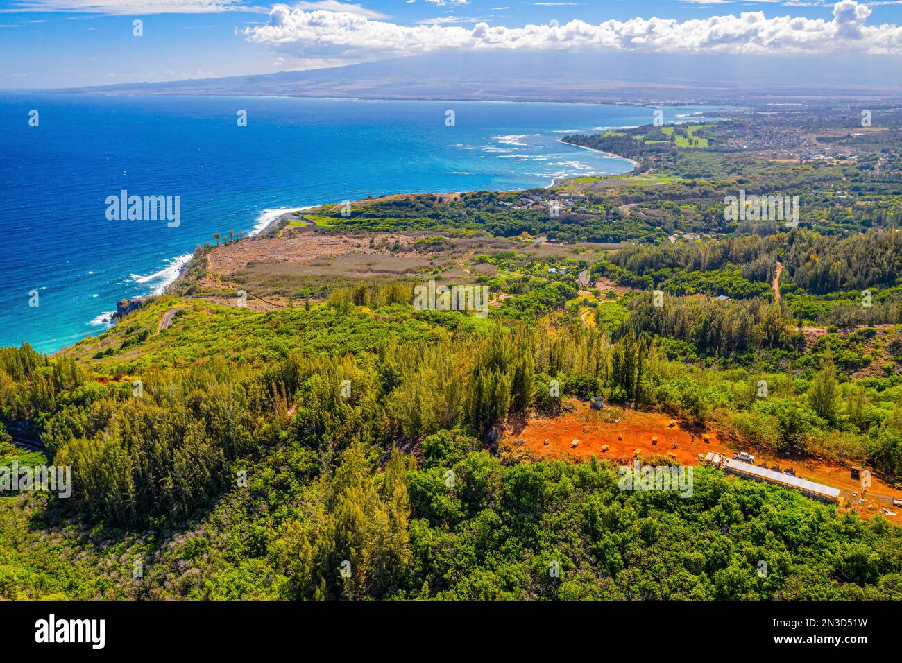 Aerial view of the lush hillside surrounding the rugged coastline of ...