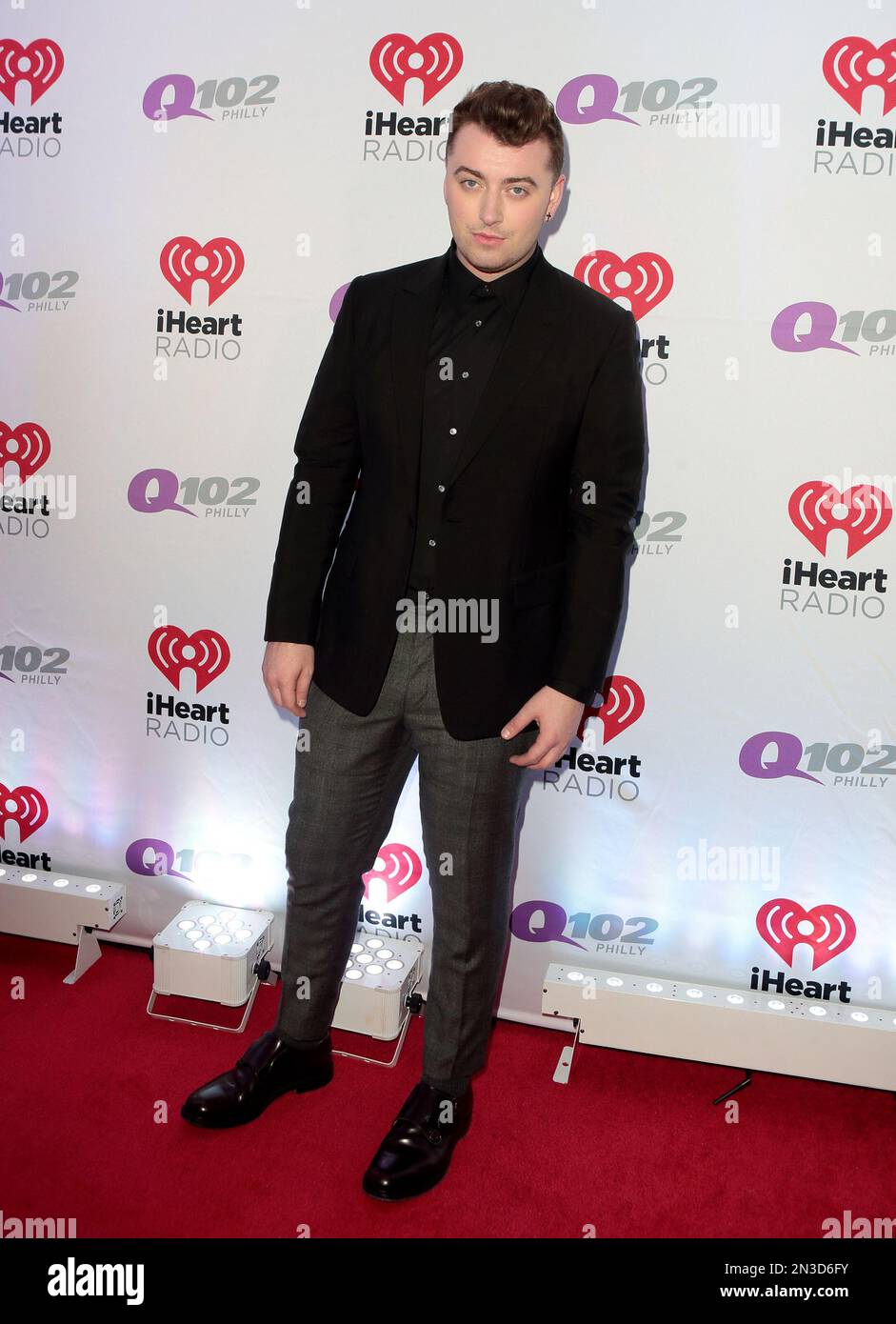 Sam Smith poses for photographers backstage during the Q102 Jingle Ball ...