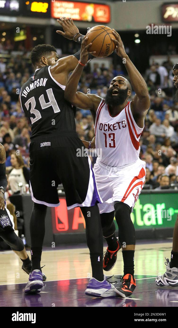 Houston Rockets guard James Harden, right, is fouled by Sacramento ...