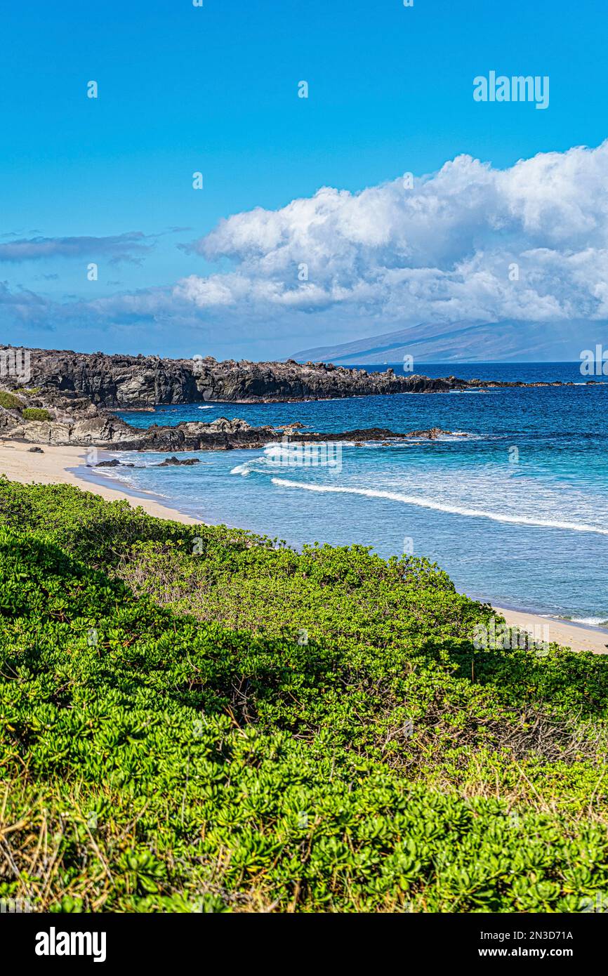 Blue sky and cumulus clouds hover over the Hawaiian Islands with the ...