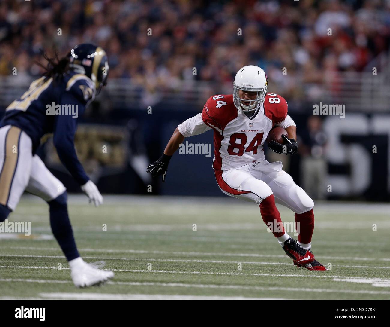 Arizona Cardinals tight end Rob Housler, right, cuts in from of St ...