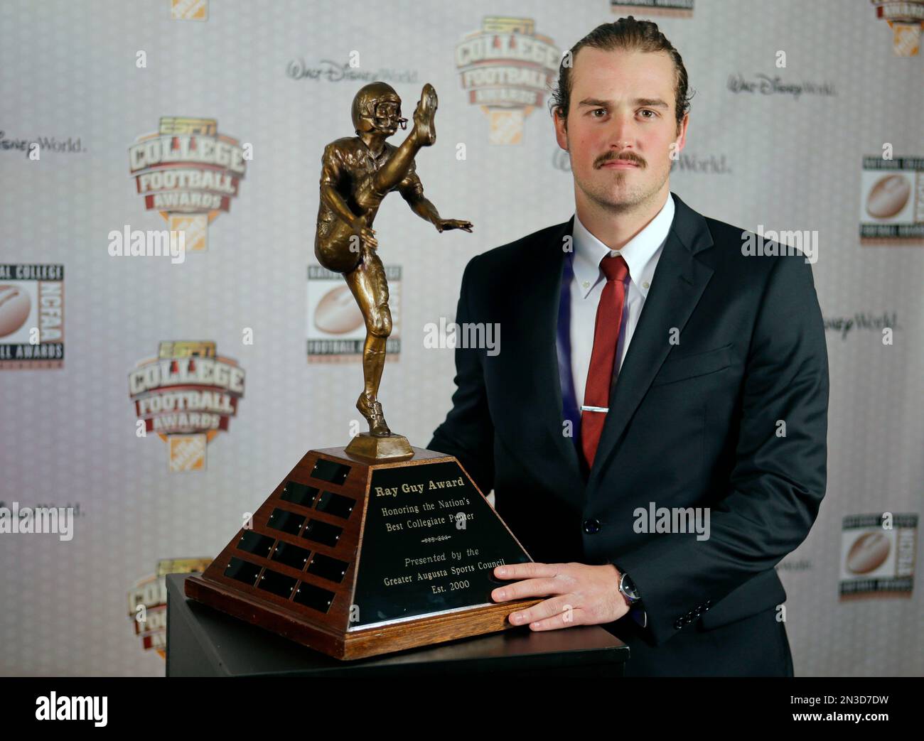 Utah's Tom Hackett stands with his trophy after being awarded the Ray ...