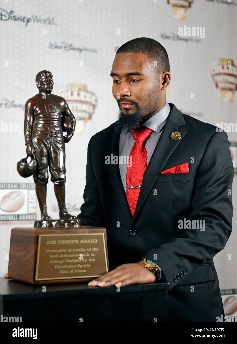 Louisville's Gerod Holliman stands with his trophy after being awarded ...