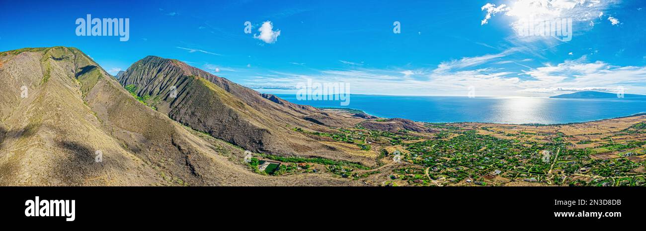 Aerial of the West Maui Mountains over Launiupoko with the sunlight ...
