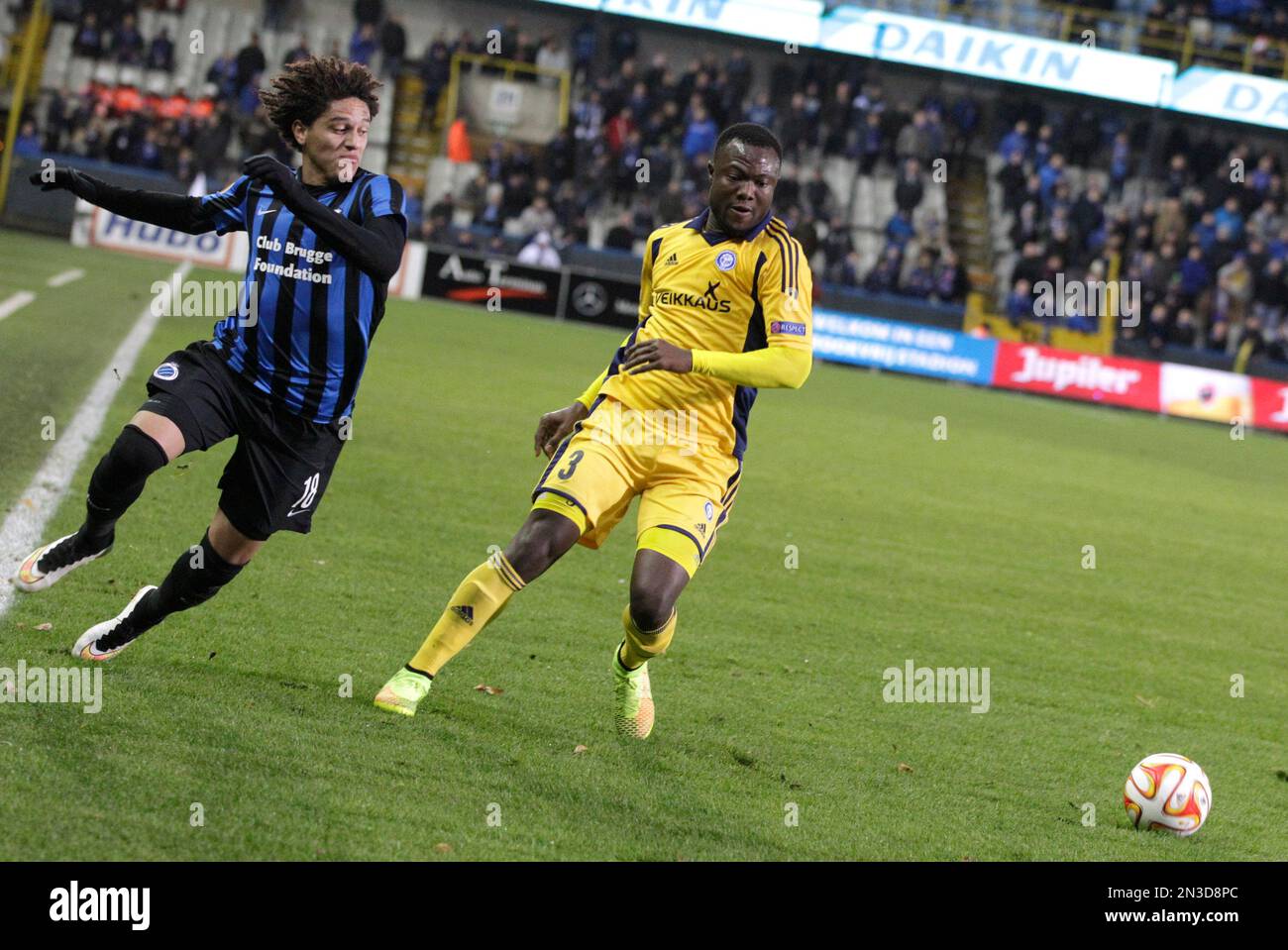 HJK's Gideon Baah, right, is challenged by Club Brugge's Felipe Gedoz ...