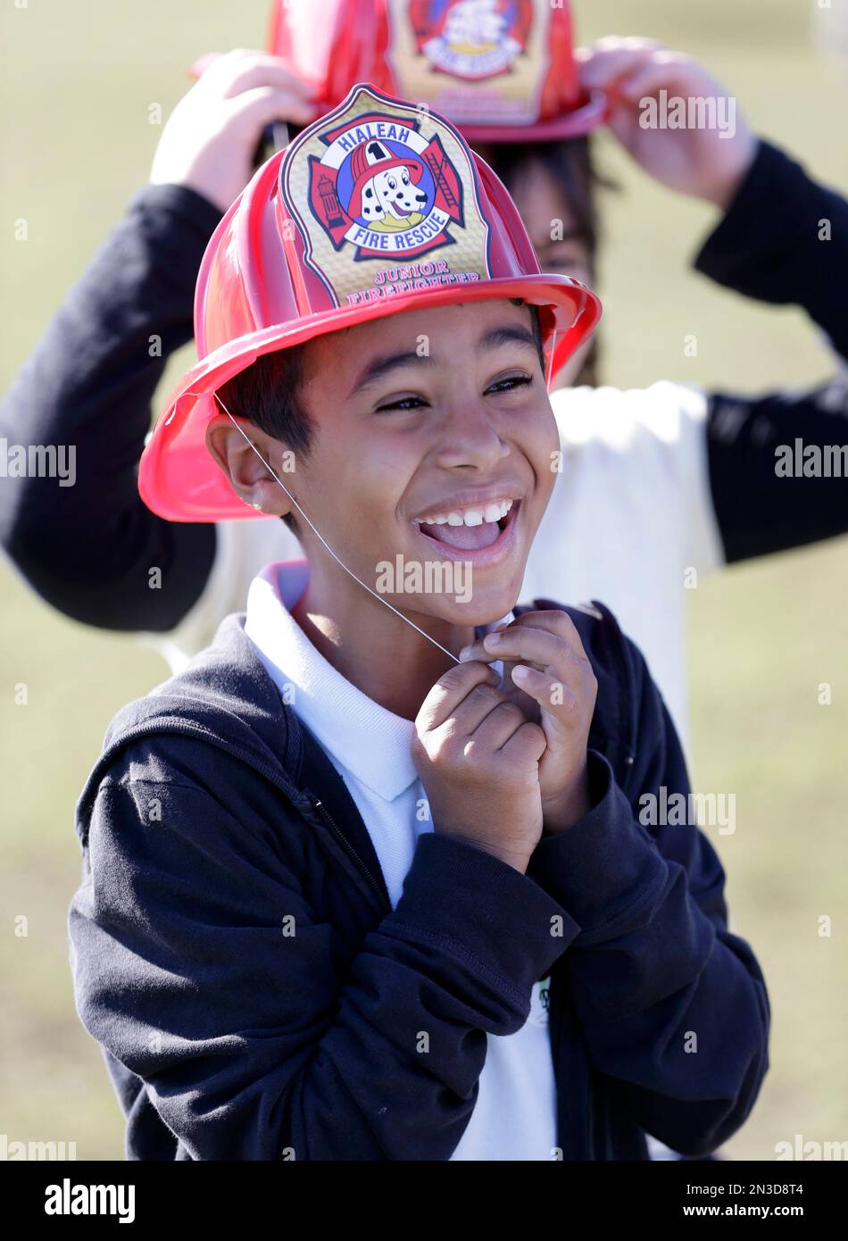 Yoslan Ramos, 9, from Palm Springs Elementary School, smiles as he puts ...