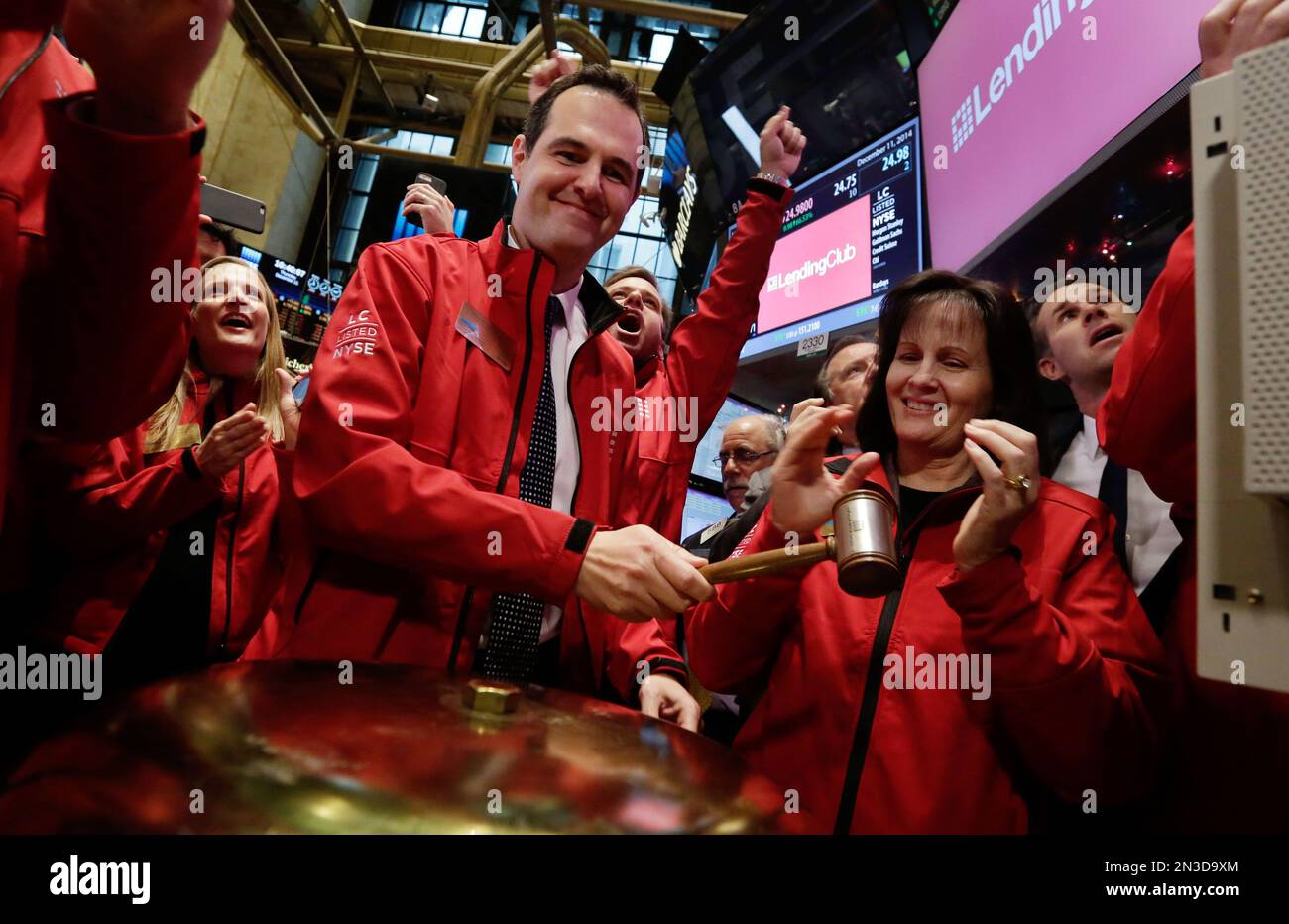 Renaud Laplanche, left, Founder & CEO of Lending Club, hands the gavel ...