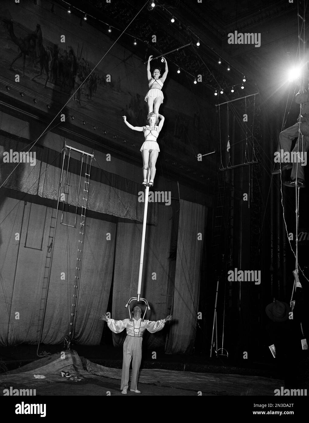 Ruth Flanagan, second from the top, holds up Mrs. Joseph Antalek on her ...