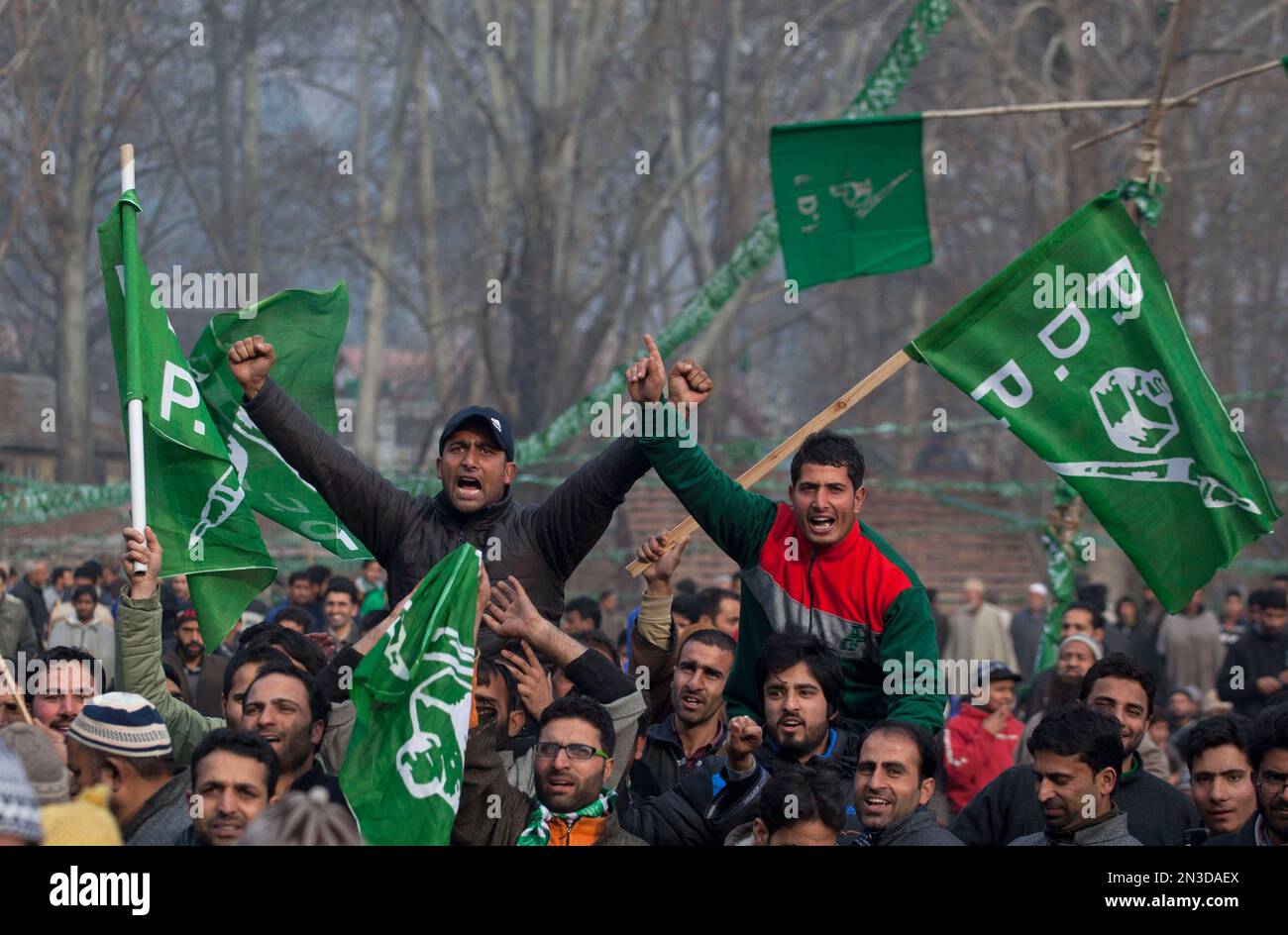 Kashmiri supporters of the Peoples Democratic Party (PDP) shout slogans ...