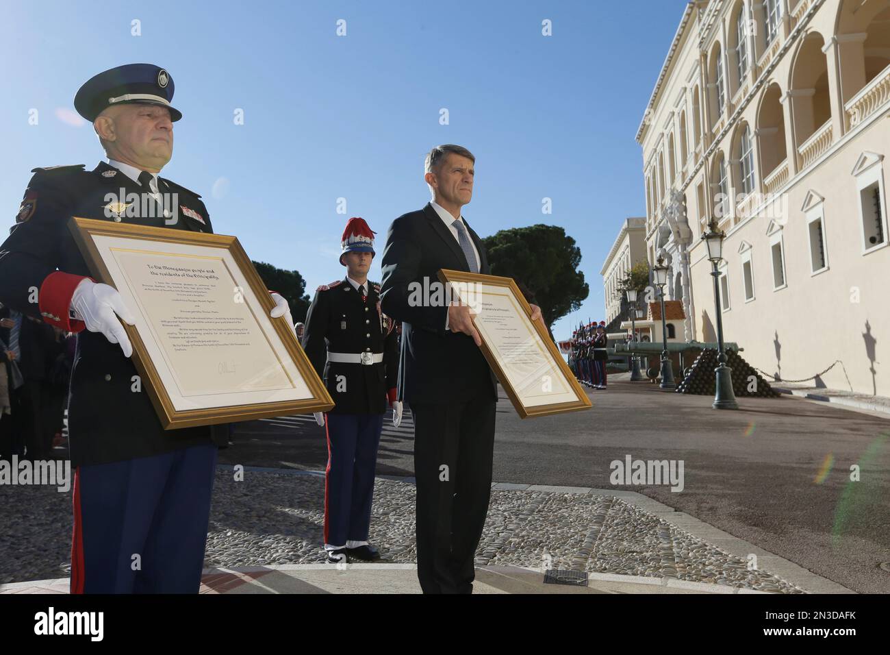 Monaco Chief of staff Luc Fringant, left, and Chamberlain Laurent Soler hold posters announcing ...