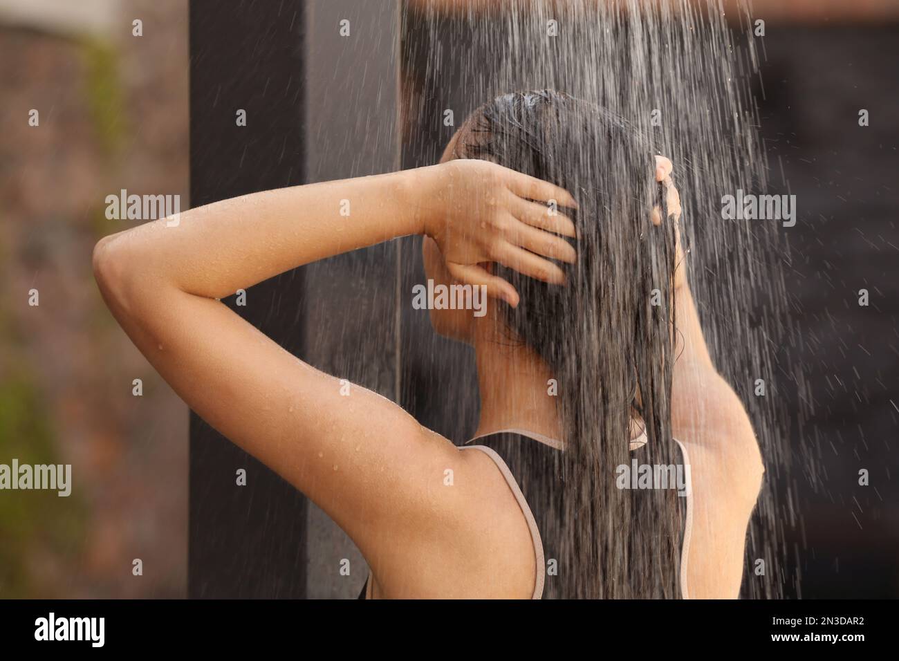 Woman washing hair in outdoor shower on summer day Stock Photo - Alamy