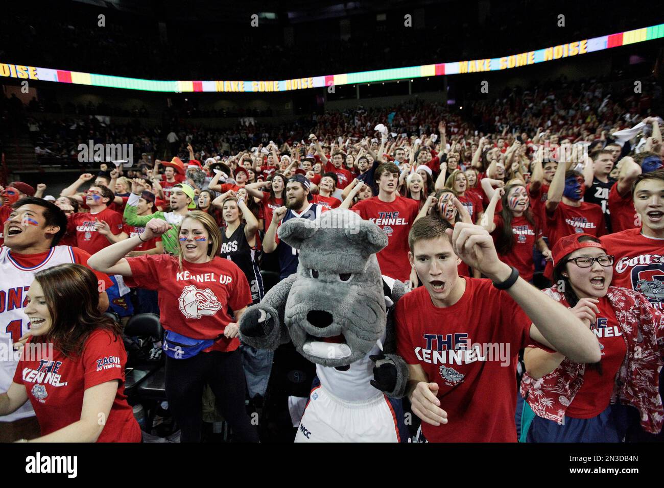 The Gonzaga mascot and fans in the student section dance before an NCAA ...
