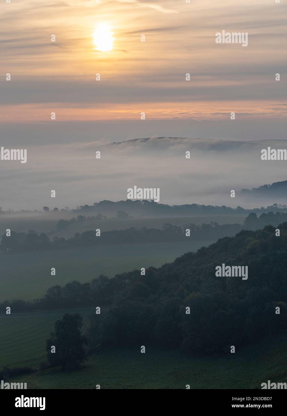 Bank of fog flows over the Long Man of Wilmington in the South Downs ...
