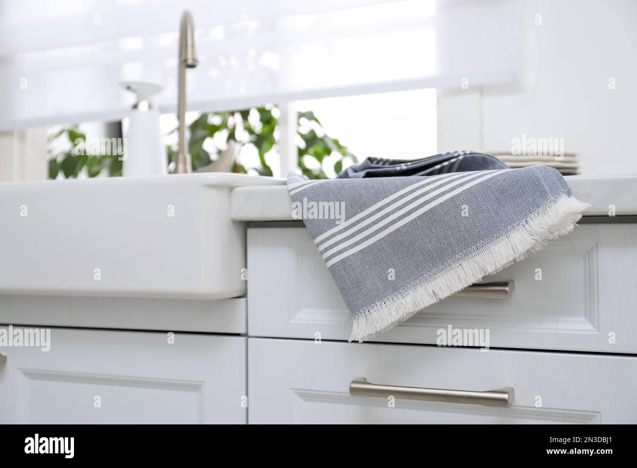 Clean kitchen towel on counter at home, closeup Stock Photo - Alamy
