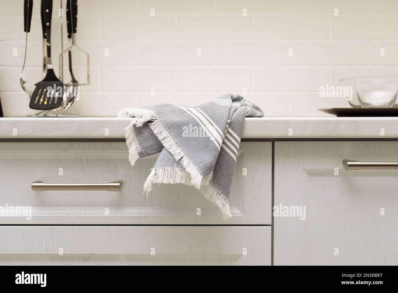 Clean kitchen towel on counter at home Stock Photo - Alamy