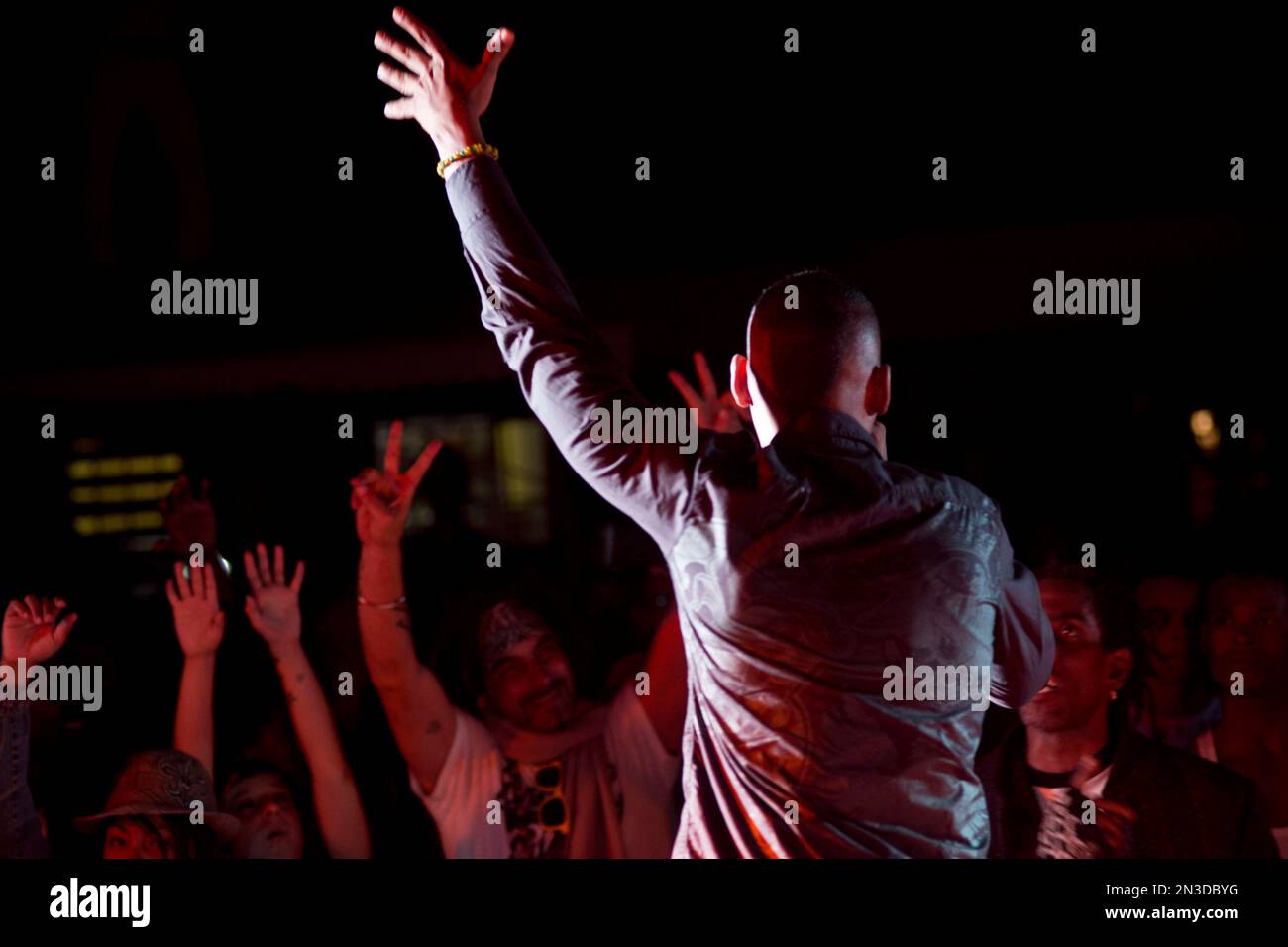 In this Nov. 30, 2014, photo, Cuban fans sing during a hip-hop concert ...