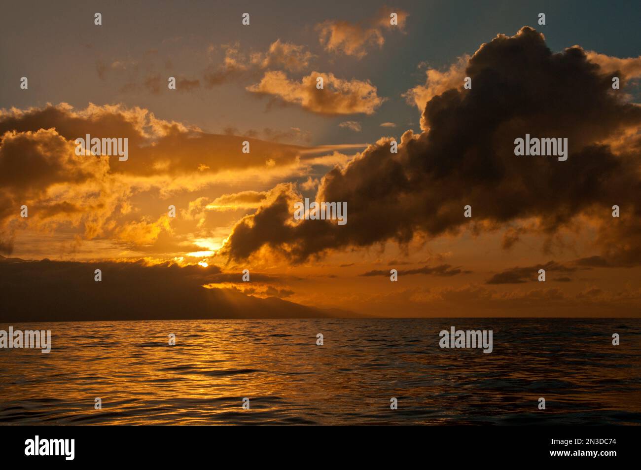 A sunrise on Maui, looking in the direction of Haleakala, a large ...