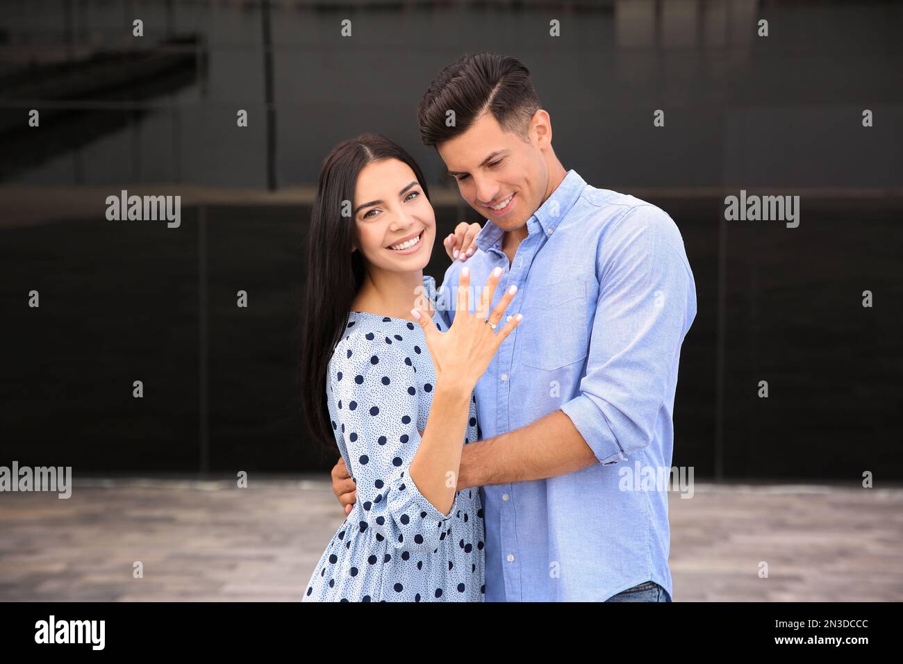 Showing her engagement ring hi-res stock photography and images - Alamy
