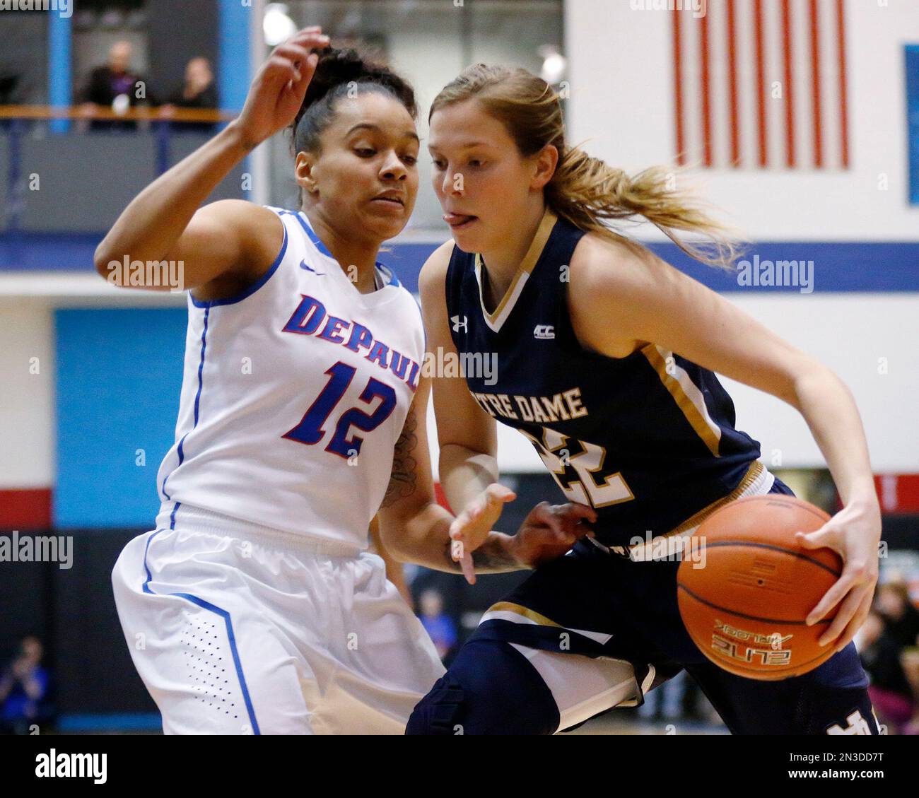 DePaul guard Brittany Hrynko (12) defends against Notre Dame guard ...
