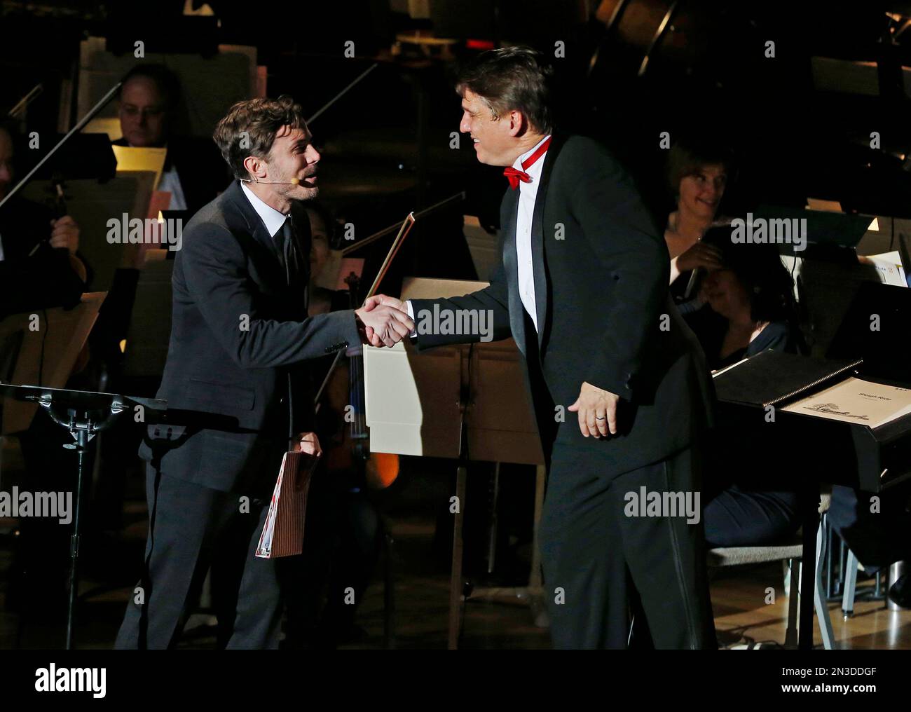 Boston Pops Conductor Keith Lockhart, right, shakes hands with actor ...