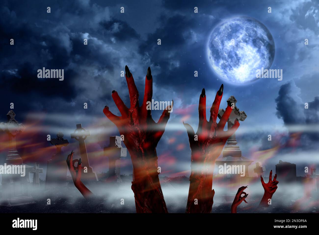 Scary monsters arising from graves at old misty cemetery under full ...