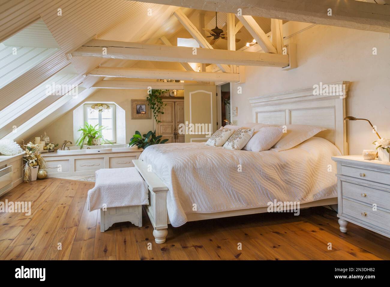 King Size Antique Wooden Bed In Master Bedroom In Attic Of Old Circa king-size-antique-wooden-bed-in-master-bedroom-in-attic-of-old-circa
