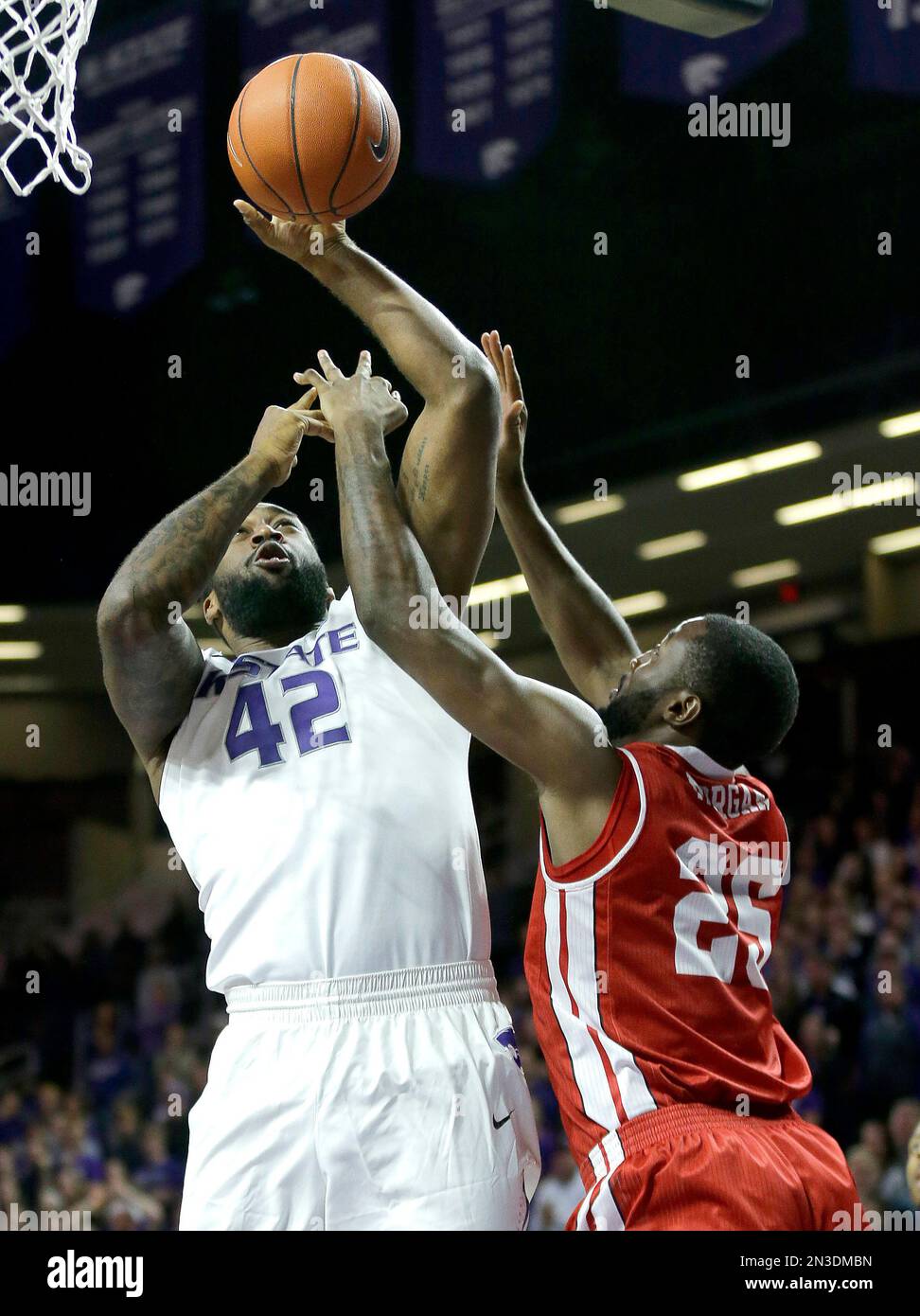 Kansas State's Thomas Gipson (42) shoots under pressure from Bradley's ...