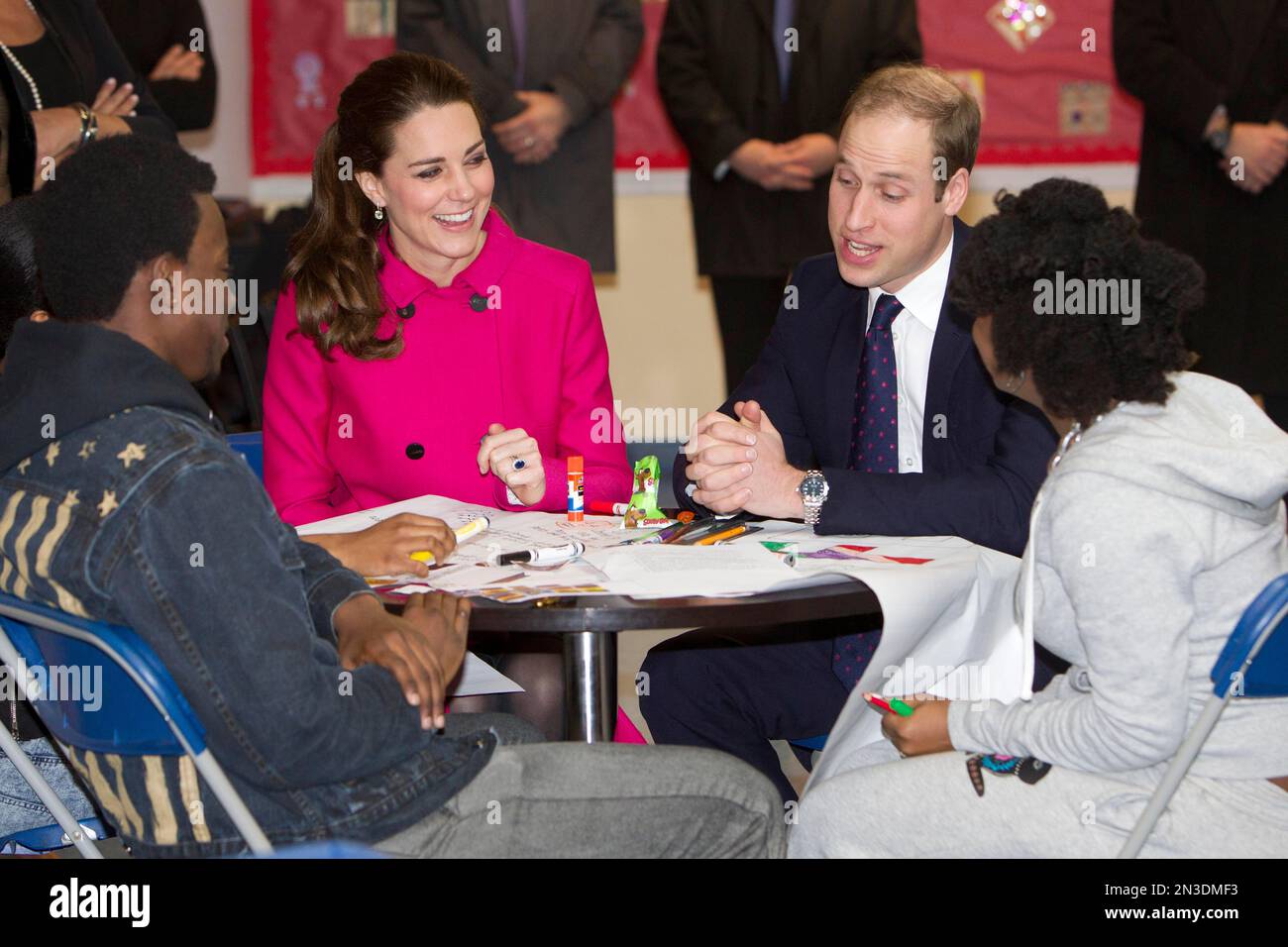 Britain's Prince William, Duke of Cambridge, top right, and his wife ...