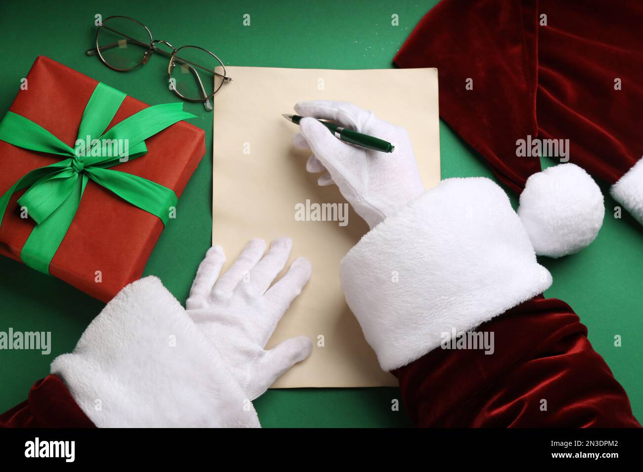 Top view of Santa writing letter at green table, closeup Stock Photo ...