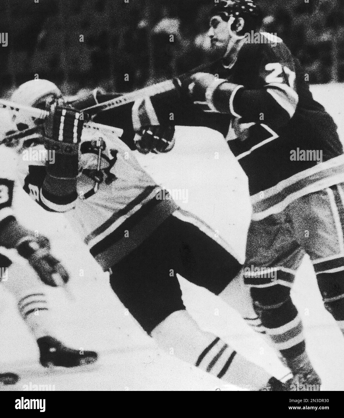 Ron Delorme of the Colorado Rockies jousts with falling Dave Schultz of ...