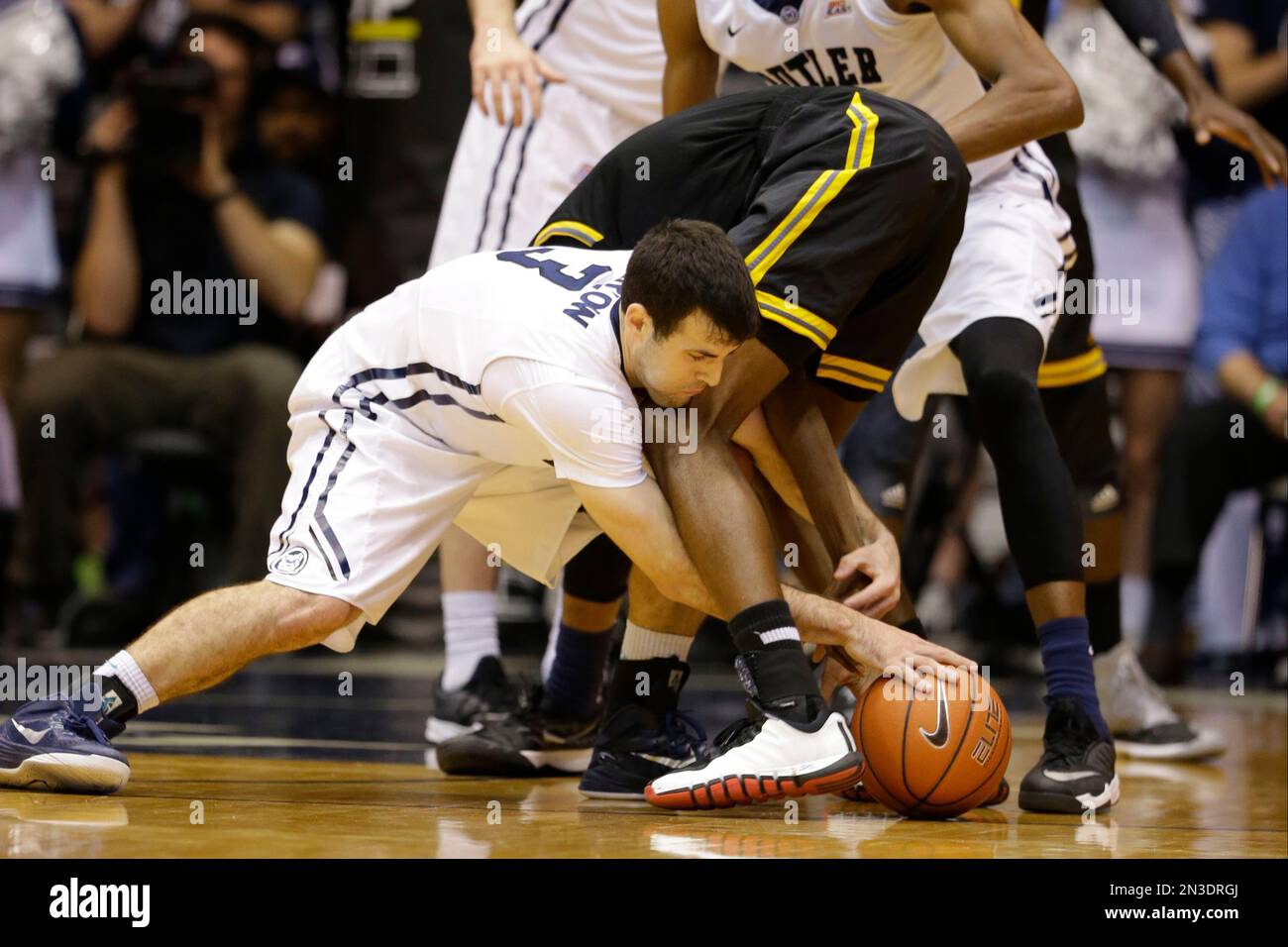 Butler guard Alex Barlow, left, to between the legs of Kennesaw State ...