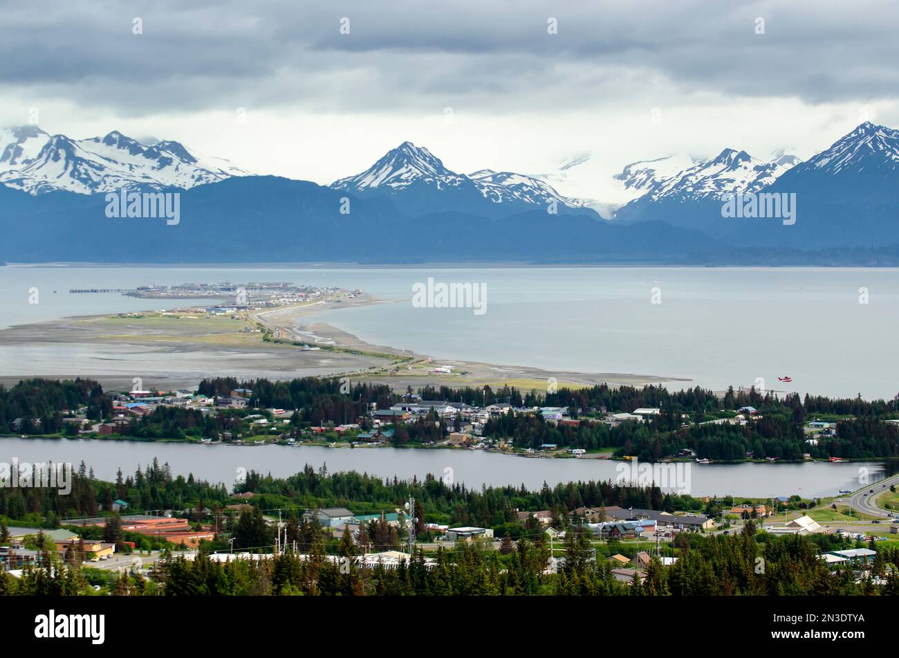 A float plane taxis and takes off from Beluga Lake in Homer, Alaska ...