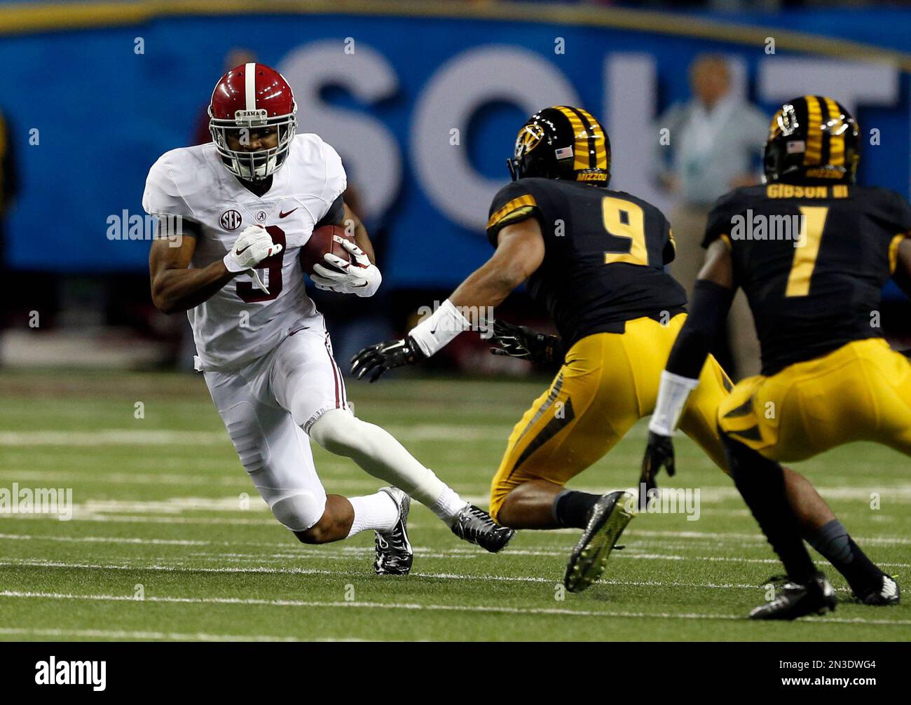 Alabama wide receiver Amari Cooper (9) carries the ball after a ...