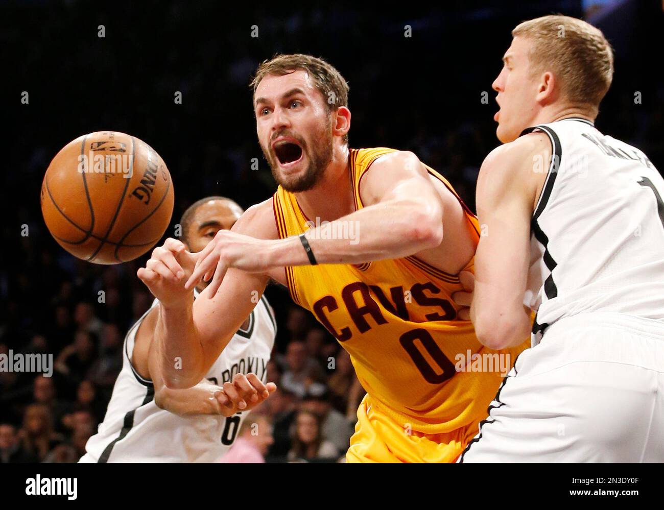 Cleveland Cavaliers forward Kevin Love (0) loses the ball as he is ...