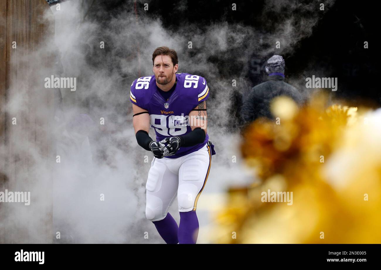 Minnesota Vikings defensive end Brian Robison runs onto the field ...