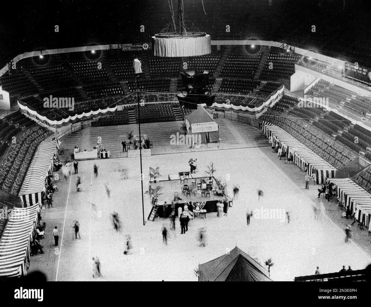 Alvin "Shipwreck" Kelly, champion flagpole sitter, stands atop his pole ...
