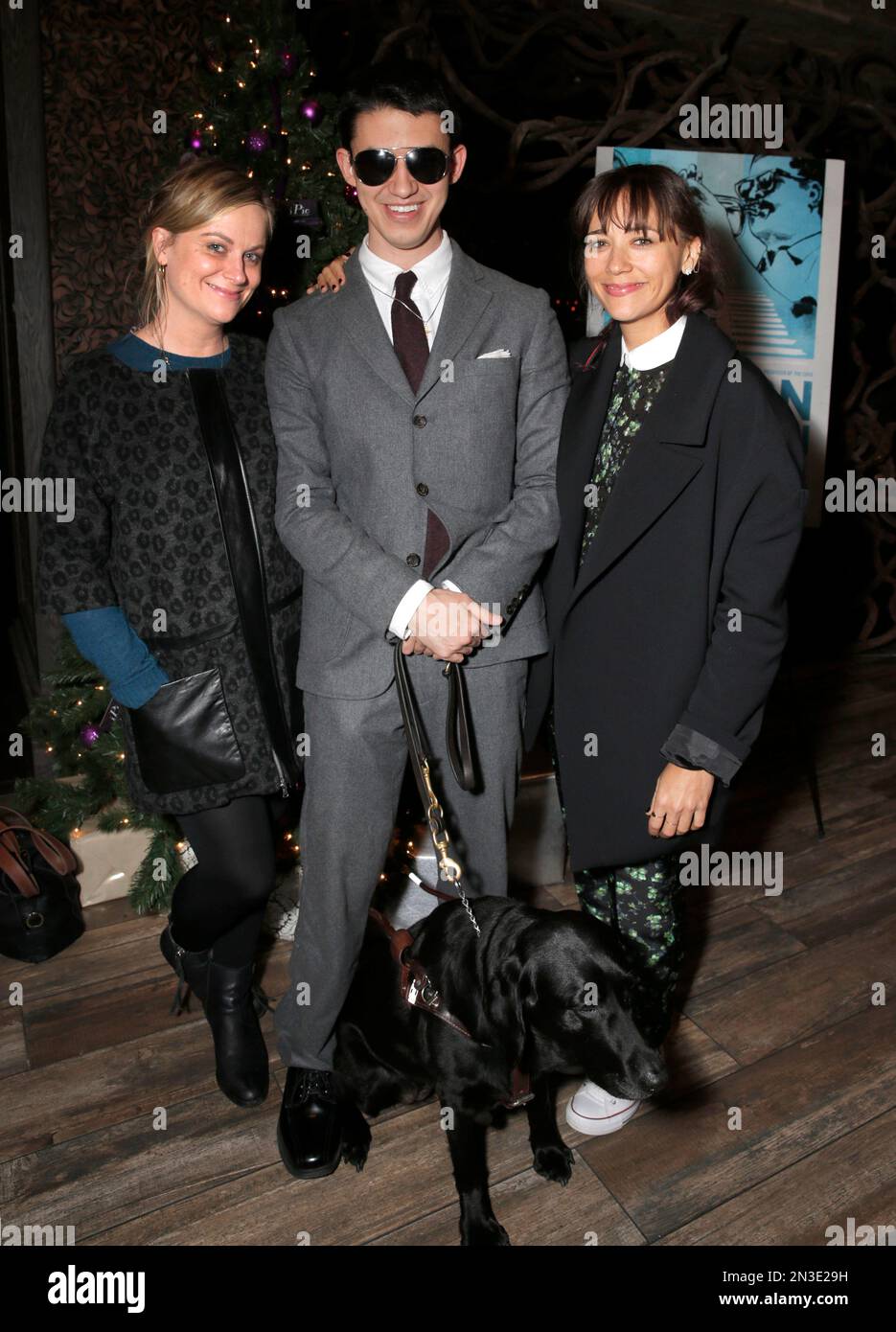 Amy Poehler, Justin Kauflin (and dog Candy) and Rashida Jones attend a ...