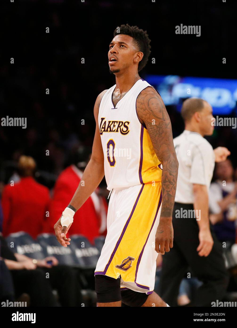 Los Angeles Lakers' Nick Young walks on the court against the New ...