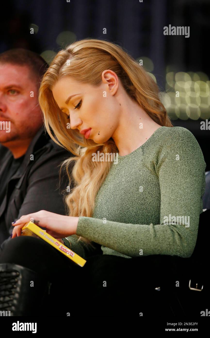 Australian recording artist Iggy Azalea sits courtside at the NBA ...
