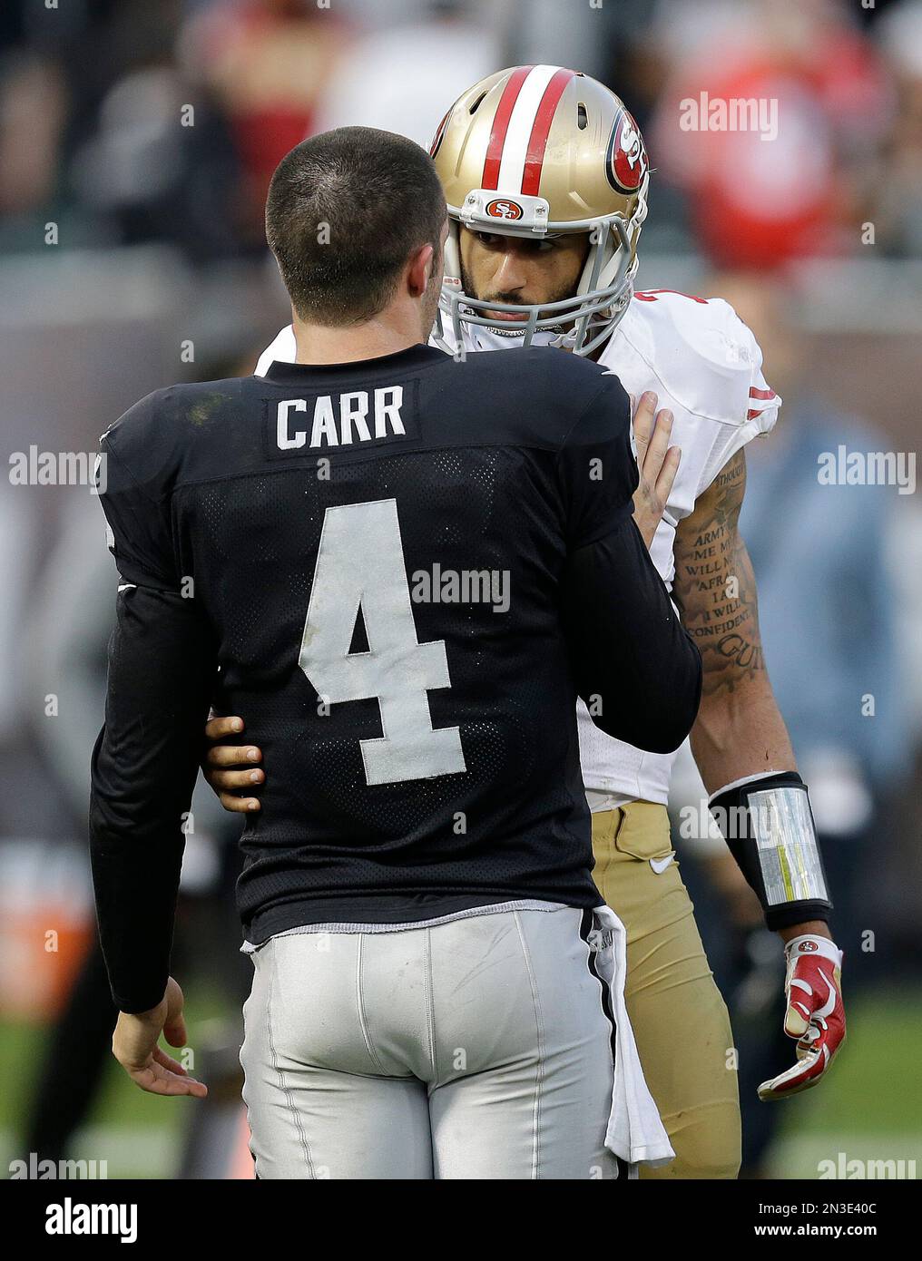 Oakland Raiders quarterback Derek Carr (4) greets San Francisco 49ers ...