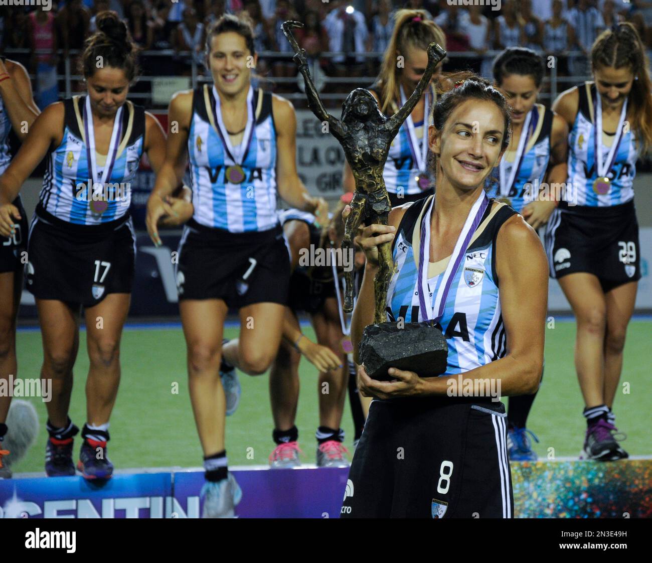Argentina's Luciana Aymar holds the trophy as she celebrates after her ...