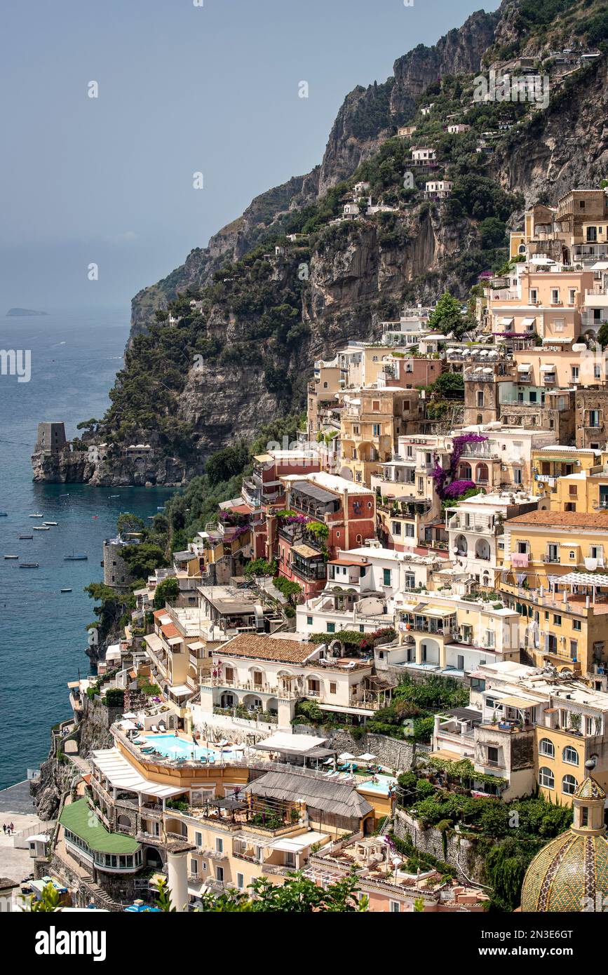 Stone buildings and terraces on the cliffside in the town of Positano ...