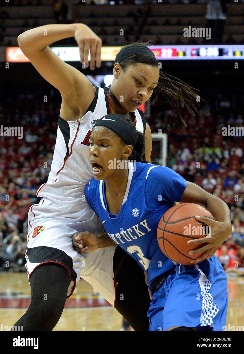 Kentucky's Janee Thompson, right, attempts to drive past the defense of ...